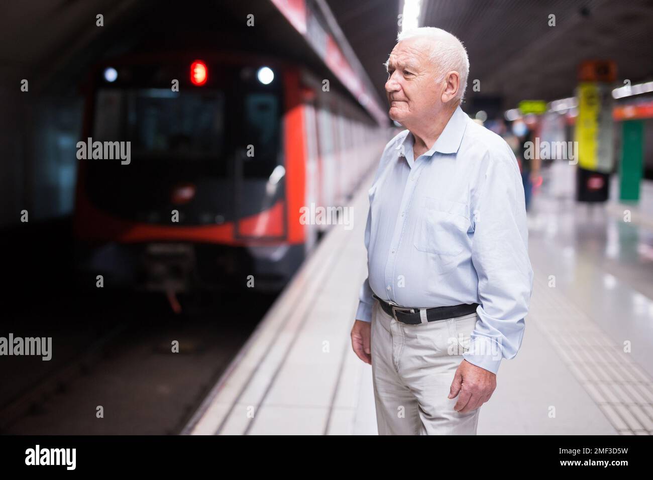 Old man in subway station Stock Photo - Alamy