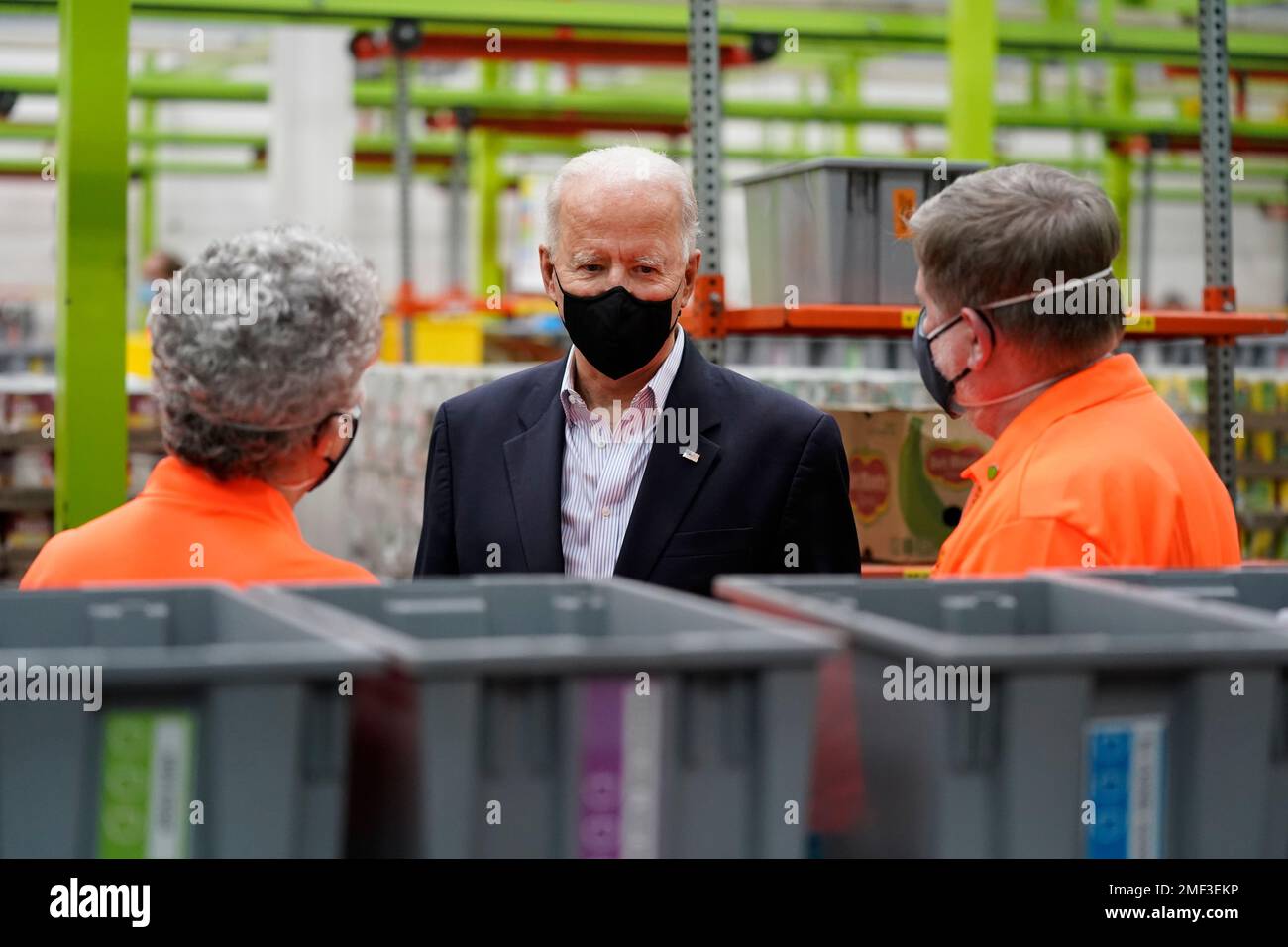 President Joe Biden visits with volunteers at the Houston Food Bank ...