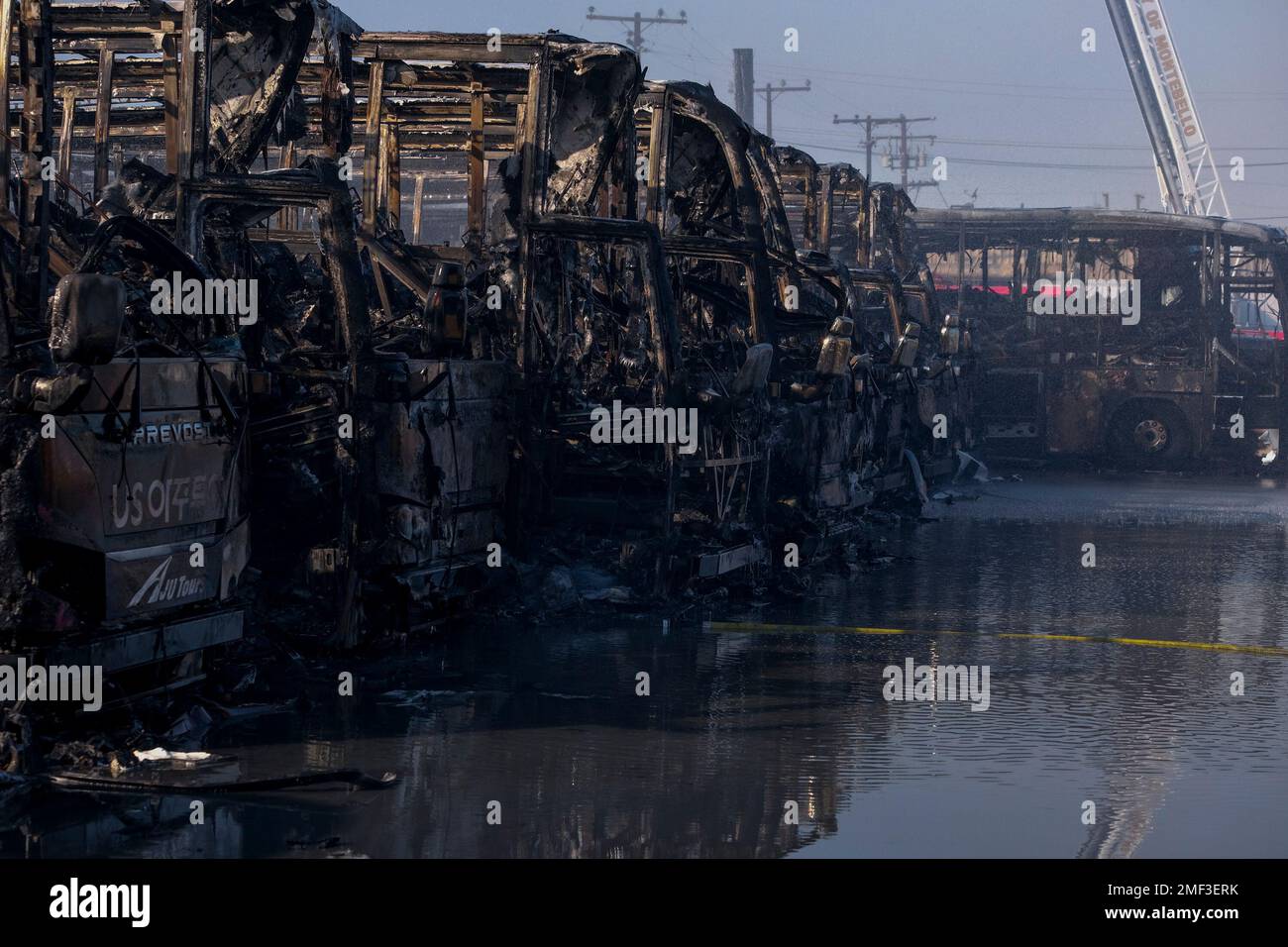 The burned buses are seen at a commercial yard in Compton, Calif., on ...