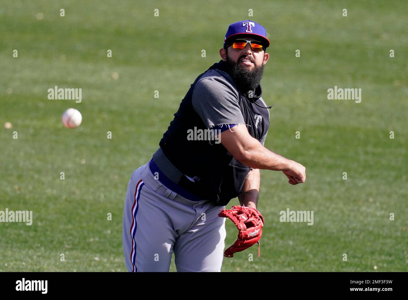 Texas Rangers' Rougned Odor throws during spring training baseball ...