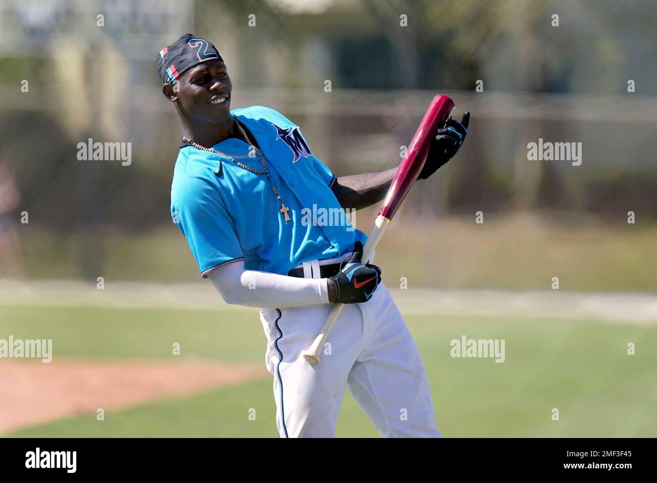 Miami Marlins' Jazz Chisholm plays air guitar during spring training ...