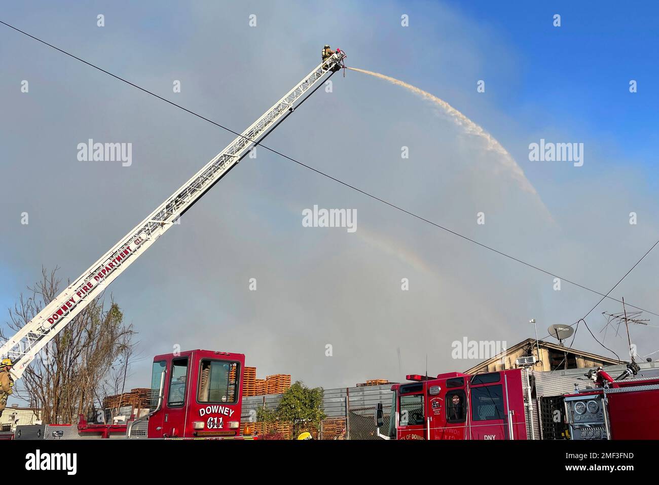 Firefighters from the Downey Fire Department battle a fire at at ...