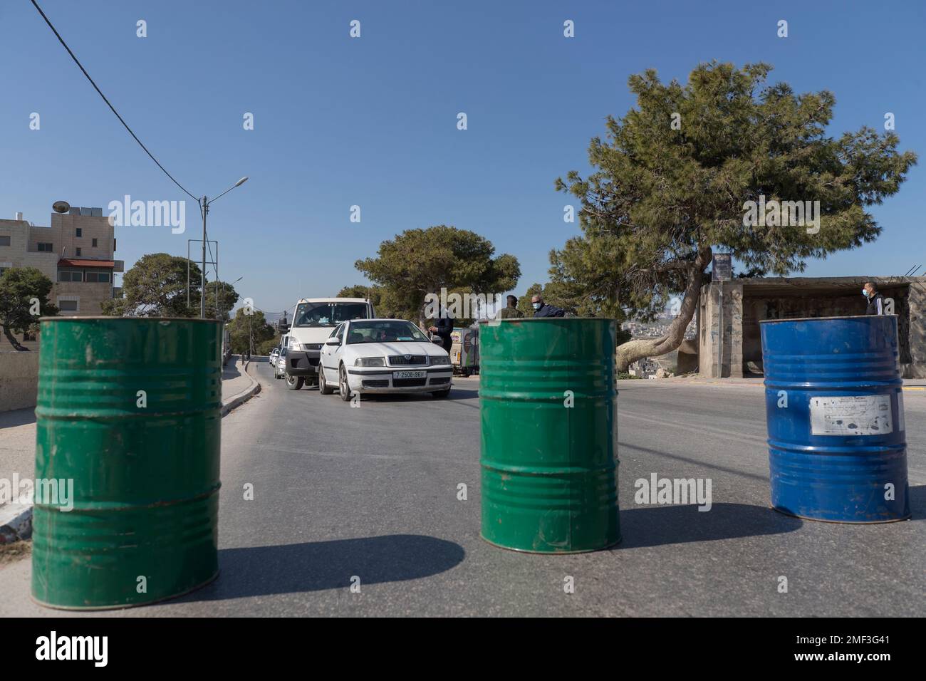 A Palestinian security unit mans a checkpoint at the entrance of the ...