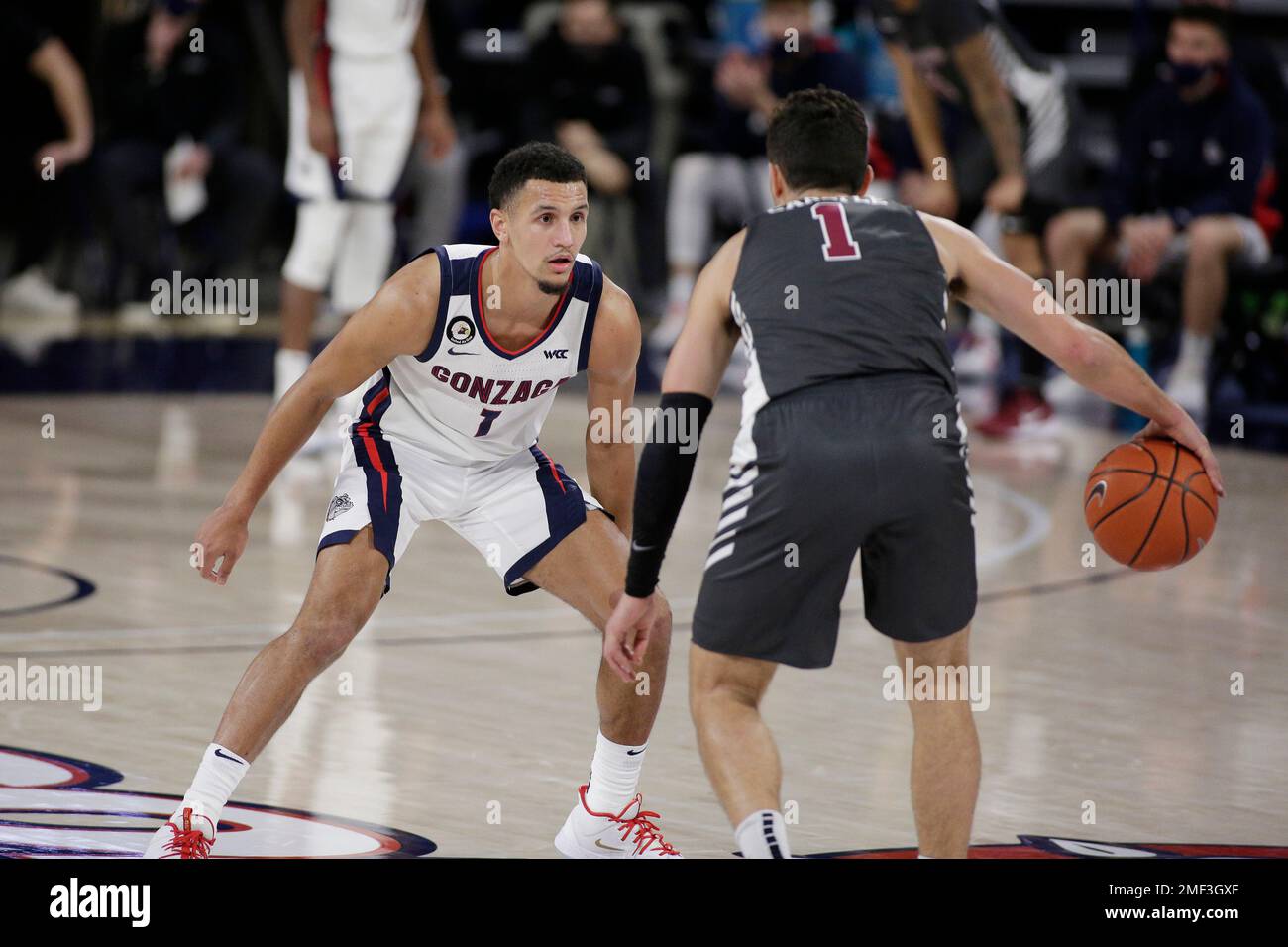 Gonzaga guard Jalen Suggs, left, defends Santa Clara guard Christian ...