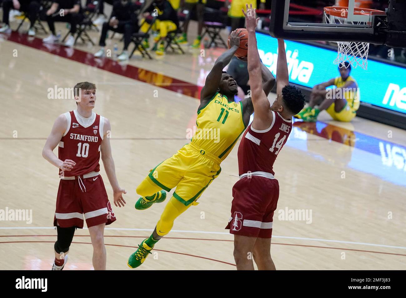 Oregon guard Amauri Hardy (11) shoots between Stanford forwards Spencer ...