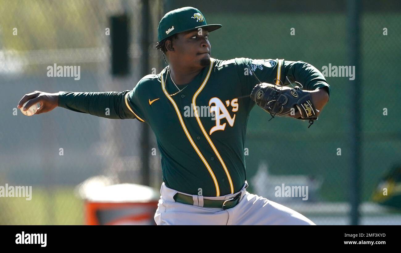Oakland Athletics pitcher Wandisson Charles throws during a spring ...