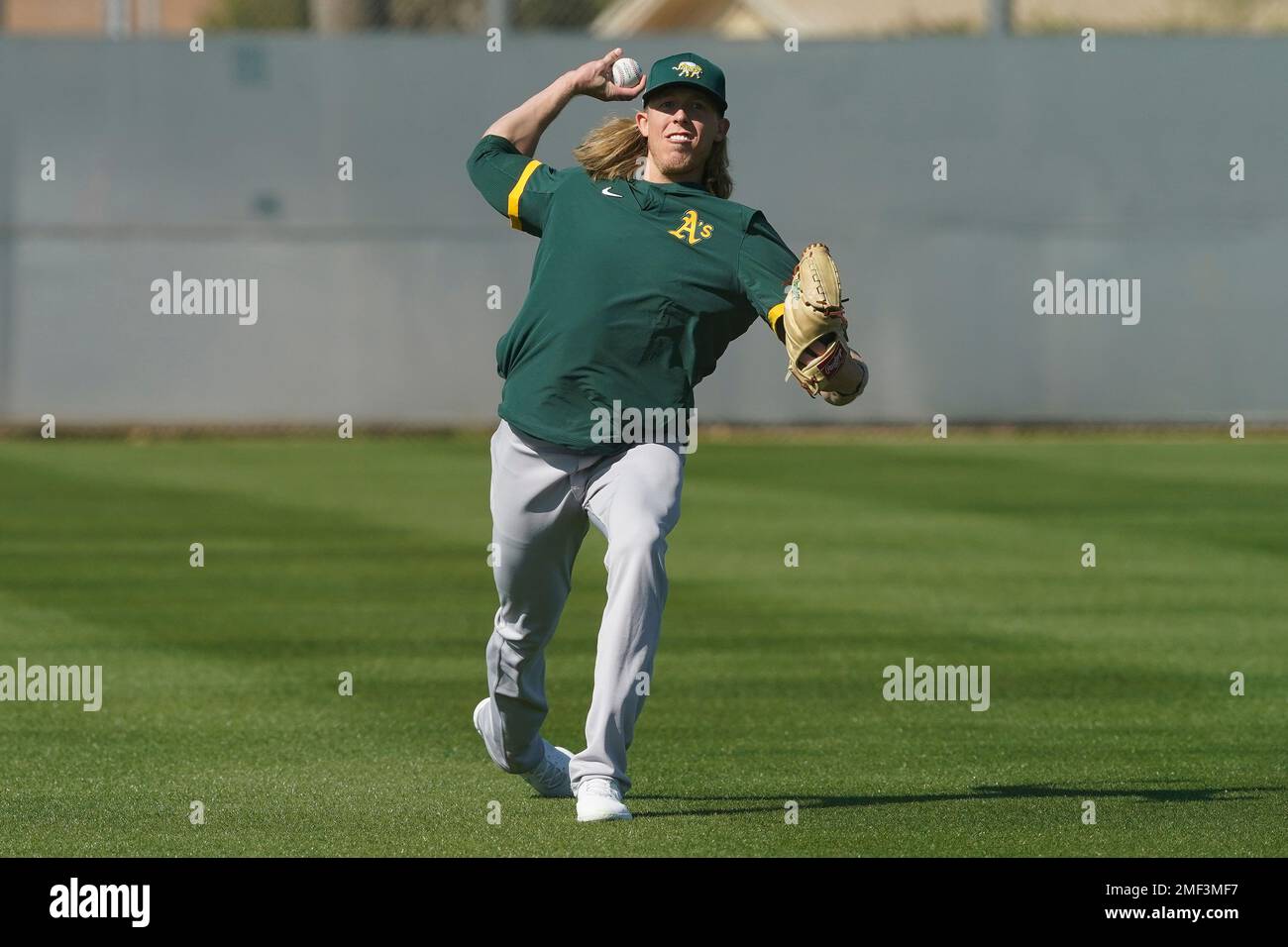 Oakland A's pitcher Jordan Weems throws during a spring training ...