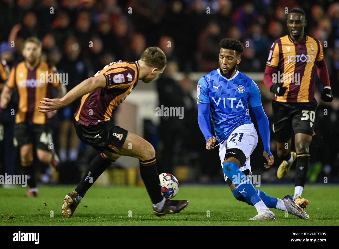 Myles Hippolyte #21 of Stockport County takes on Matthew Platt #5 of ...