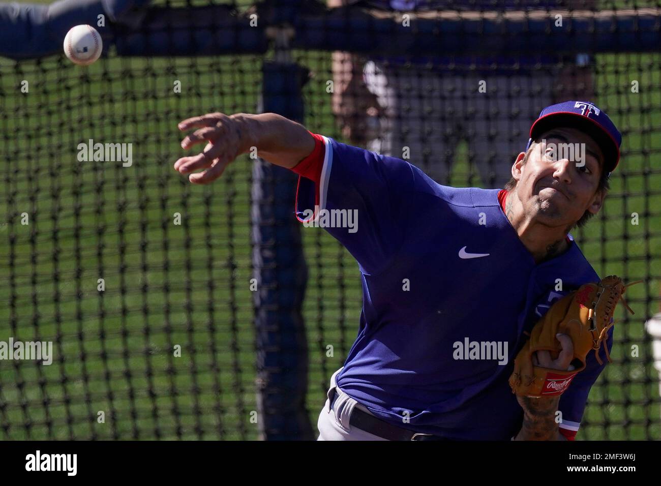 Texas Rangers pitcher Hans Crouse throws during spring training ...