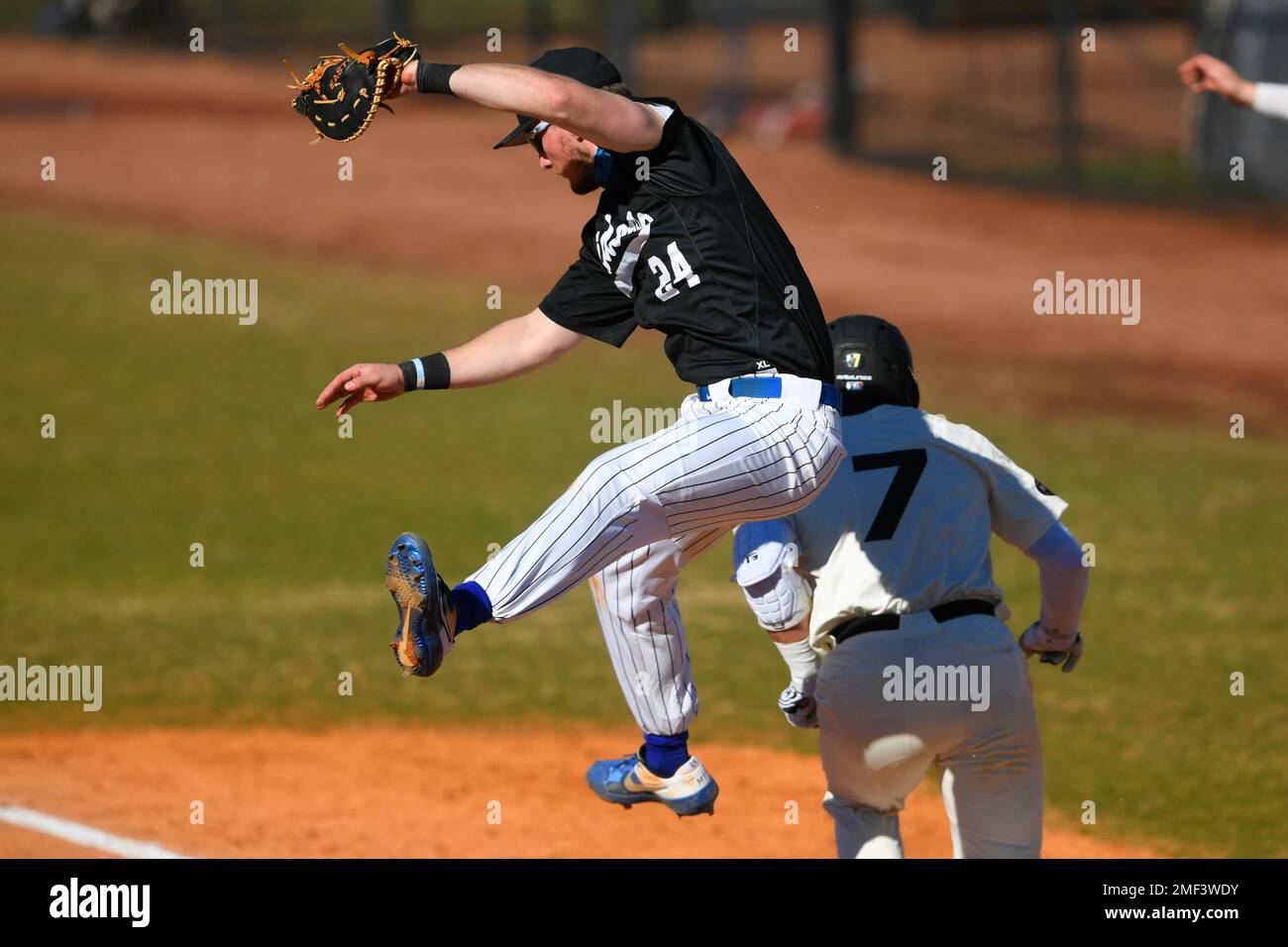 Oakland's Tyler Trovinger is safe at first base as Middle Tennessee ...