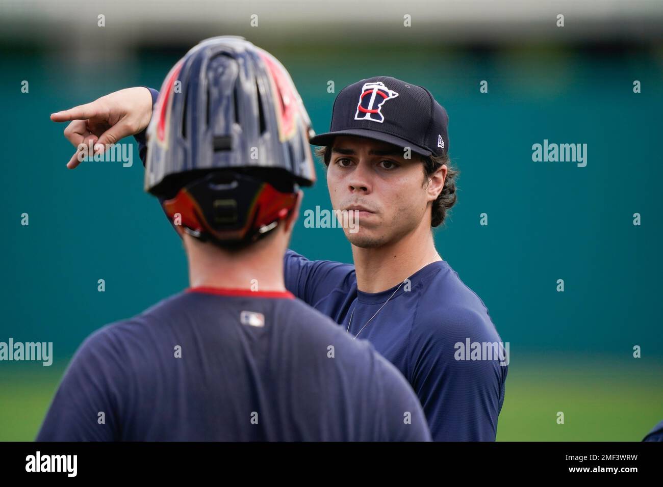 Minnesota Twins starting pitcher Dakota Chalmers, rear, talks to a ...