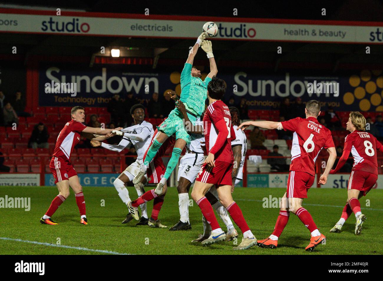 Toby Savin #40 of Accrington Stanley claims the cross during the ...