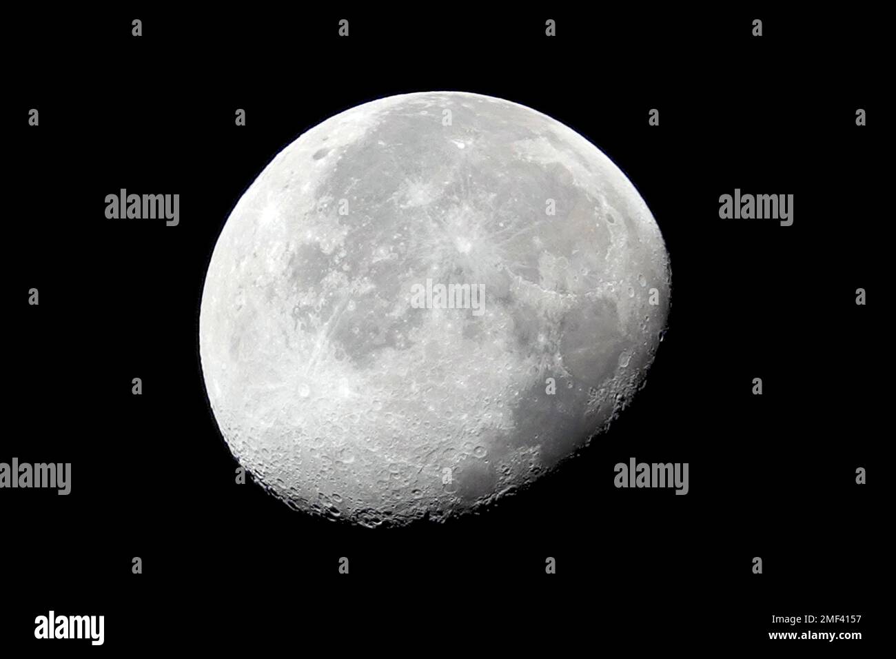 A closeup shot of the moon shining bright in the dark night sky for ...