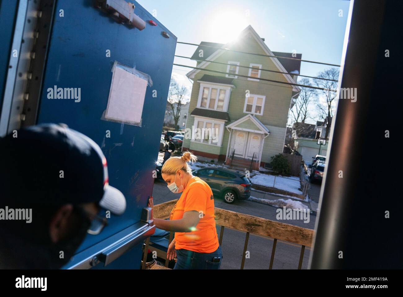 Mayor Maria Rivera holds the door open for a patient after they ...