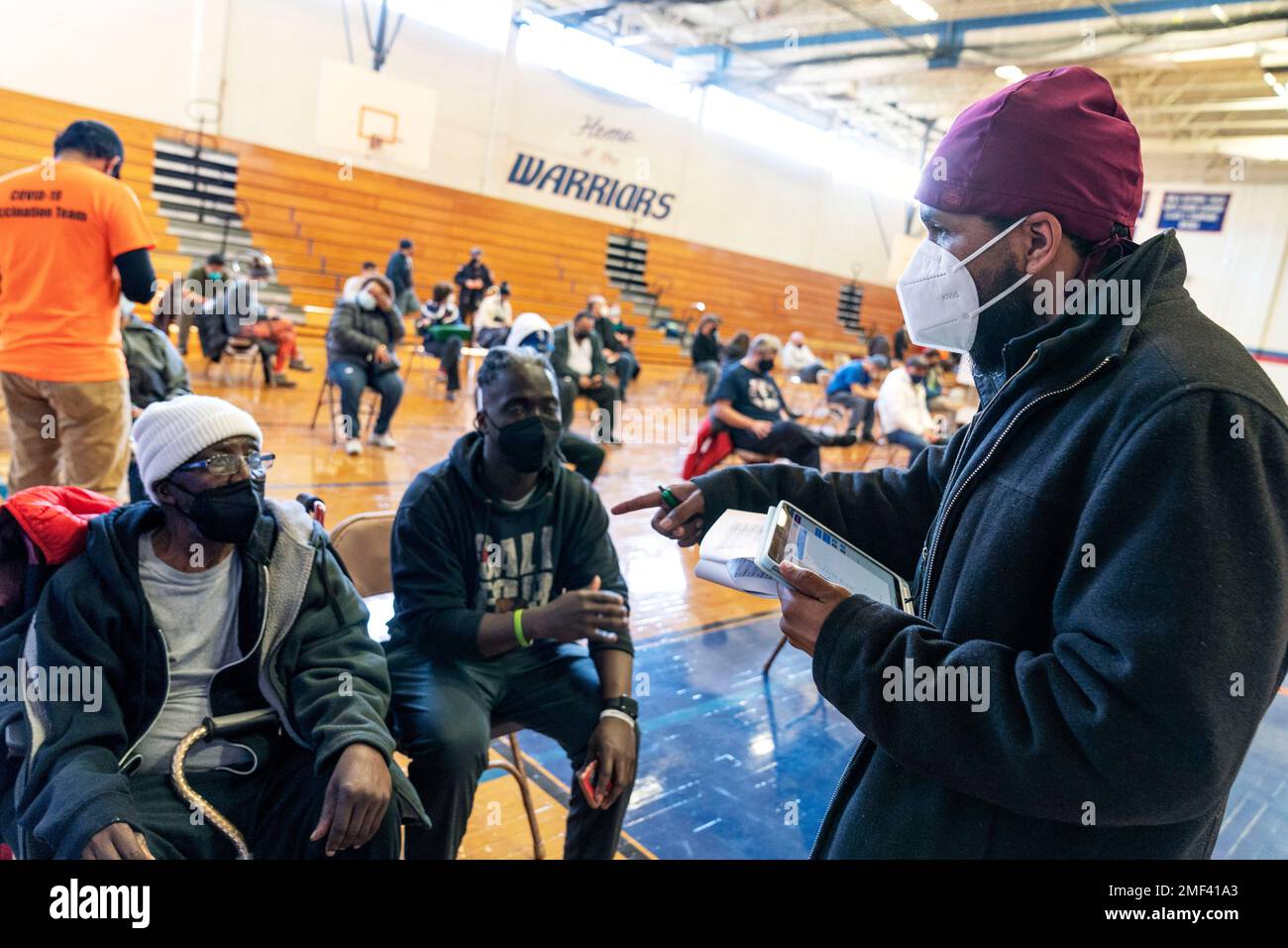 Dr. Eugenio Fernandez, right, checks on his patients, Baffour Ankoman ...