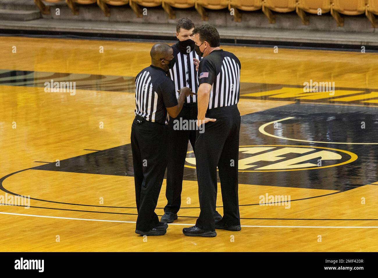 SEC referees confer during the second half of an NCAA college ...