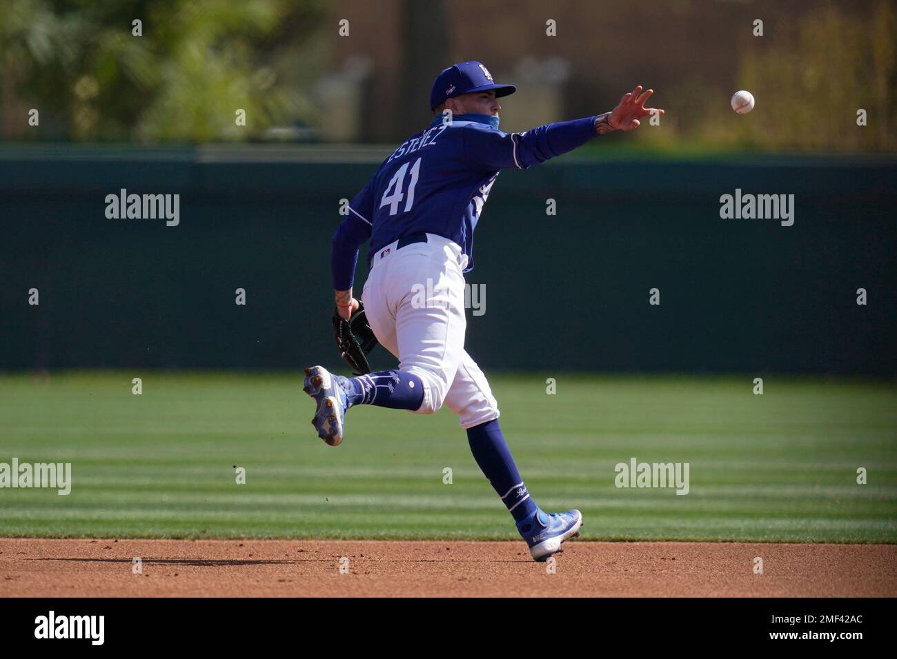 Los Angeles Dodgers infielder Omar Estevez flips the ball to second ...