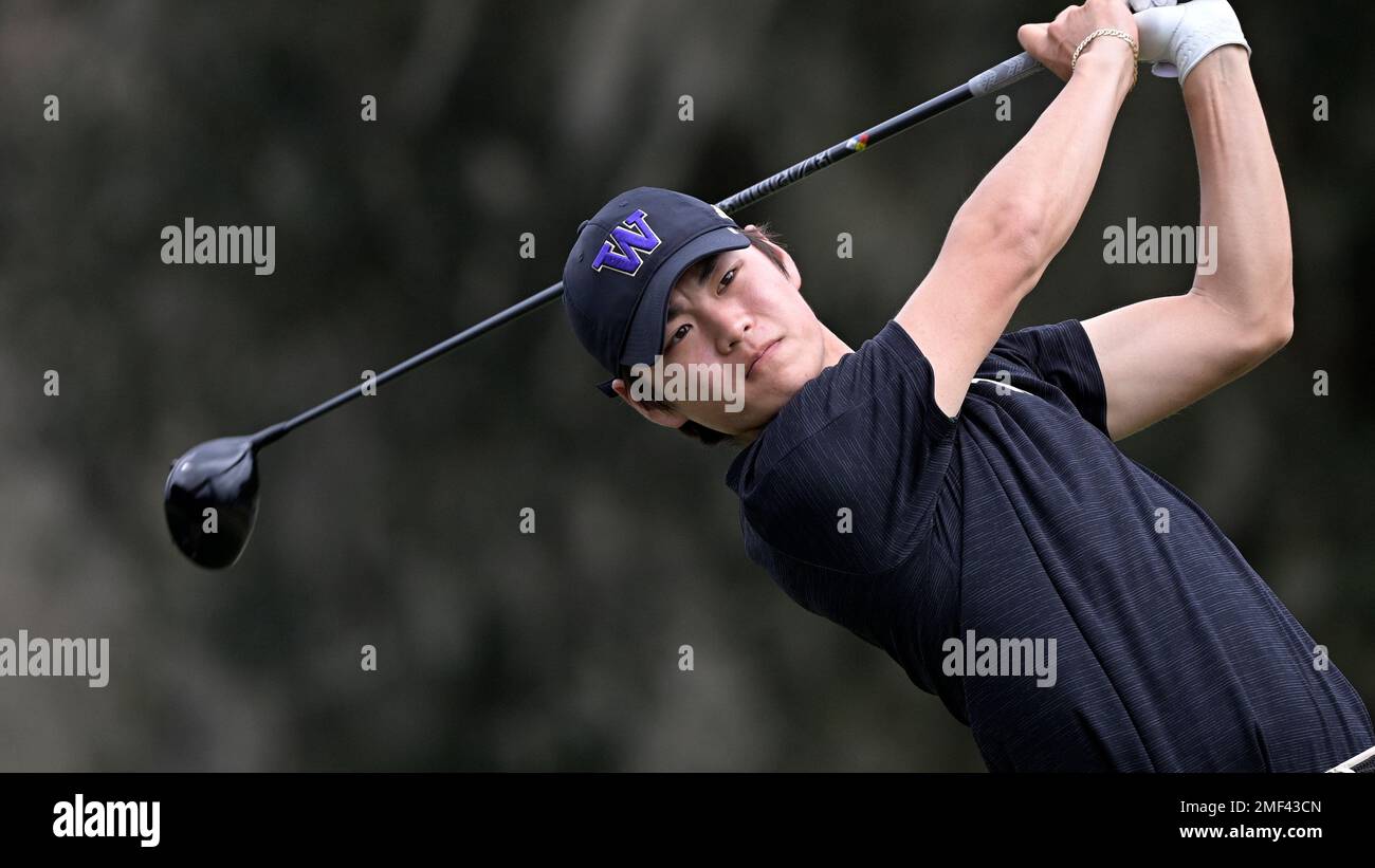 Taehoon Song, of Washington, watches his tee shot on the 16th hole ...