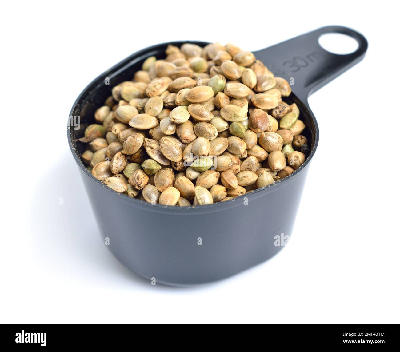 Heap of hemp seeds isolated on white background Stock Photo - Alamy