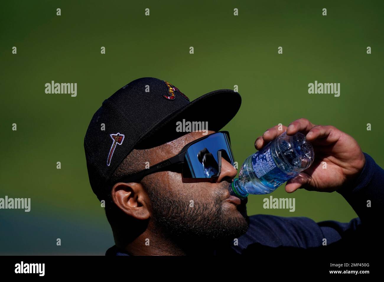Atlanta Braves' Pablo Sandoval drinks water during spring training ...