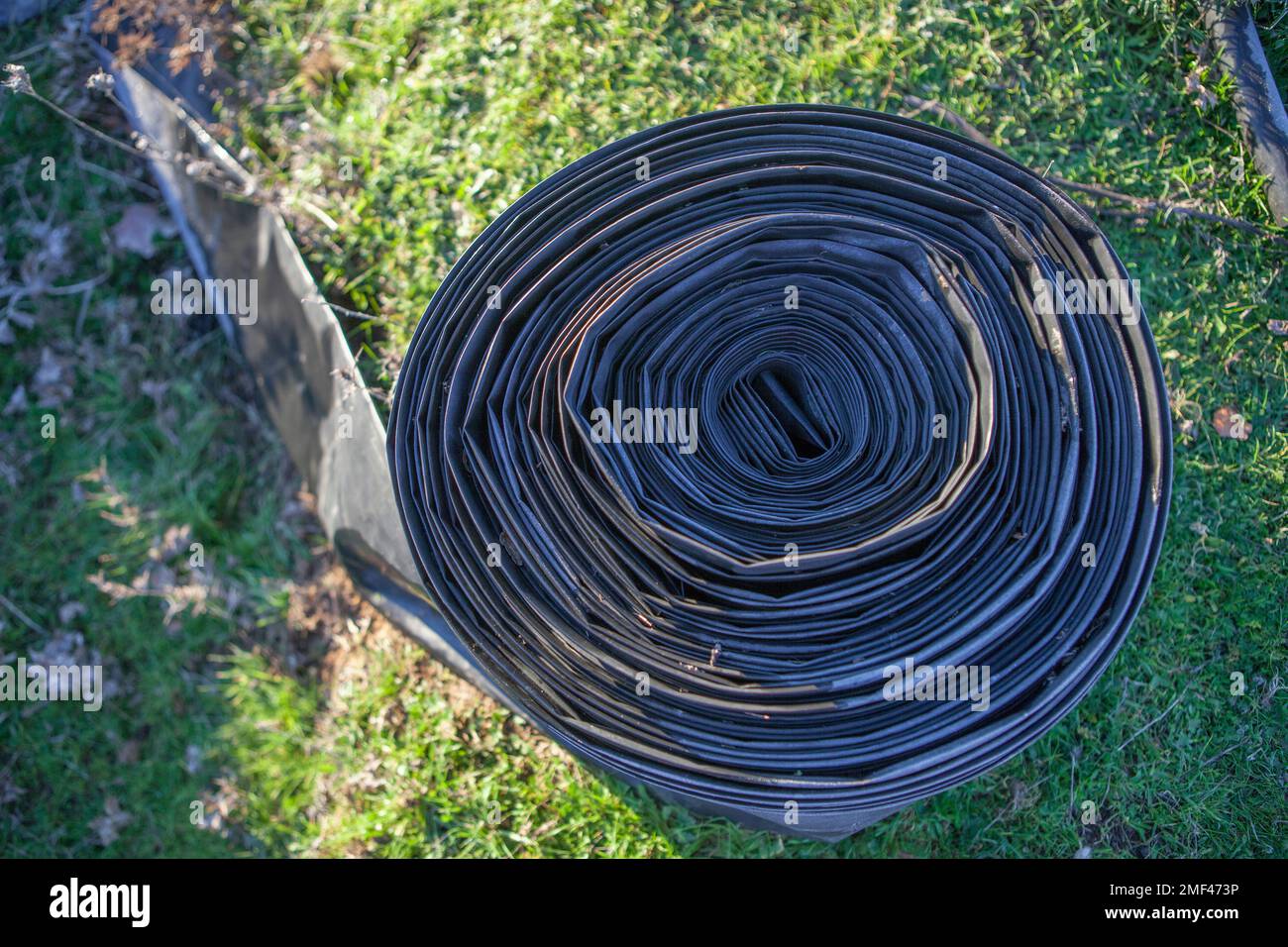 Rolled tape of flexible irrigation tubing system. Overhead view Stock ...