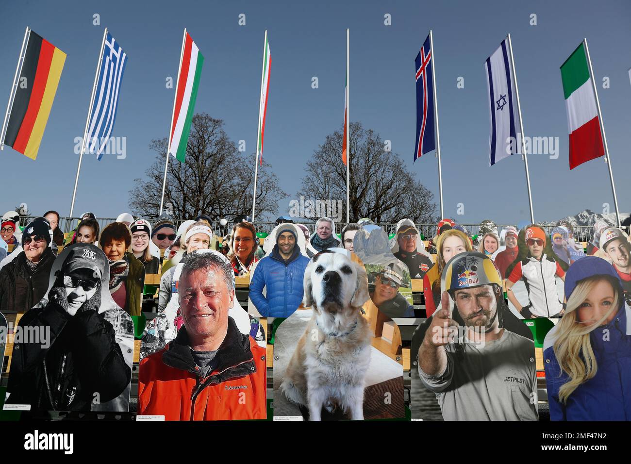 Cardboard spectators stand at the cross country stadium while athletes ...