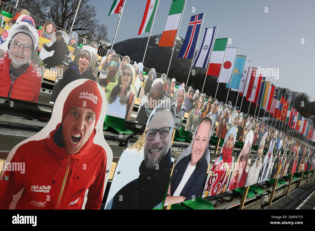 Cardboard spectators stand at the cross country stadium while athletes ...