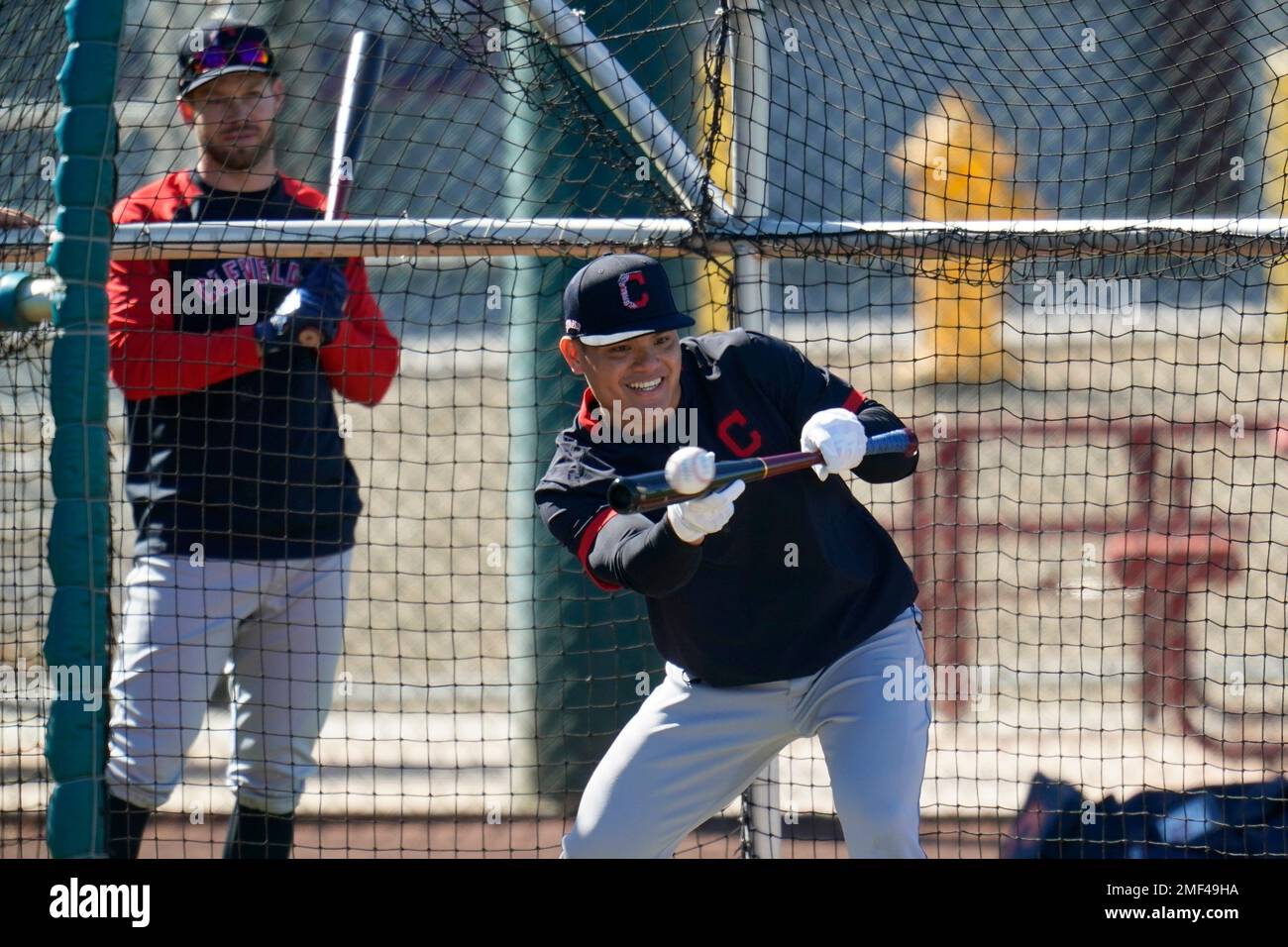 Cleveland Indians' Yu Chang, right, of Taiwan, smiles as he bunts ...