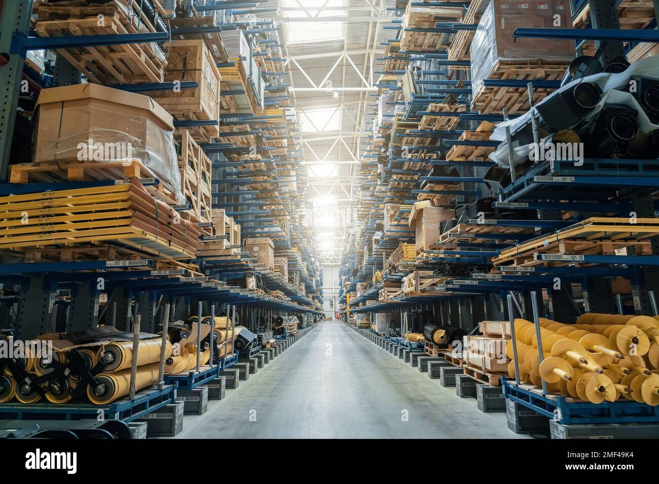 Modern distribution warehouse interior with many goods in boxes on ...