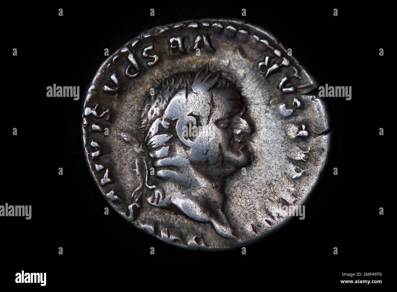 Roman silver denarius coin showing portrait of emperor Flavius ...