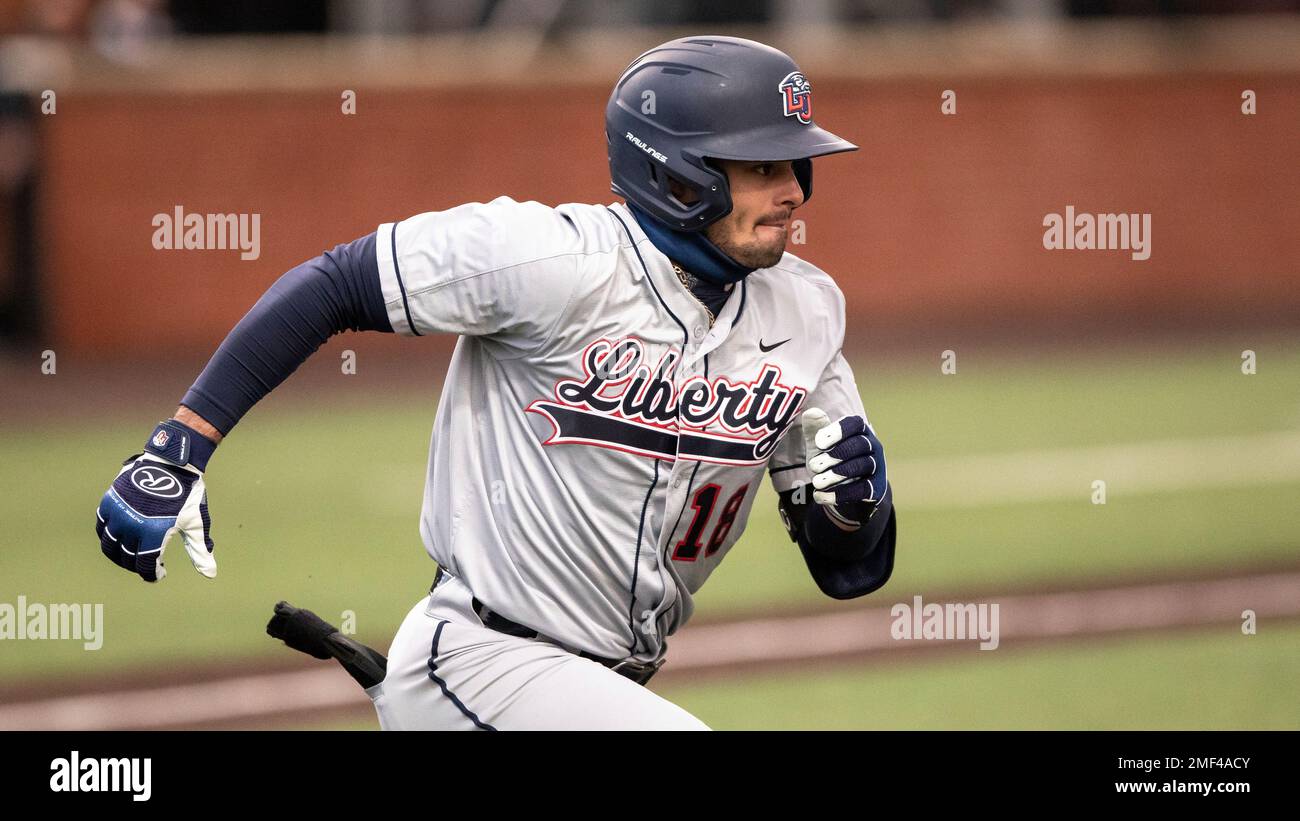 Liberty's Cam Locklear (18) runs towards first base during an NCAA ...