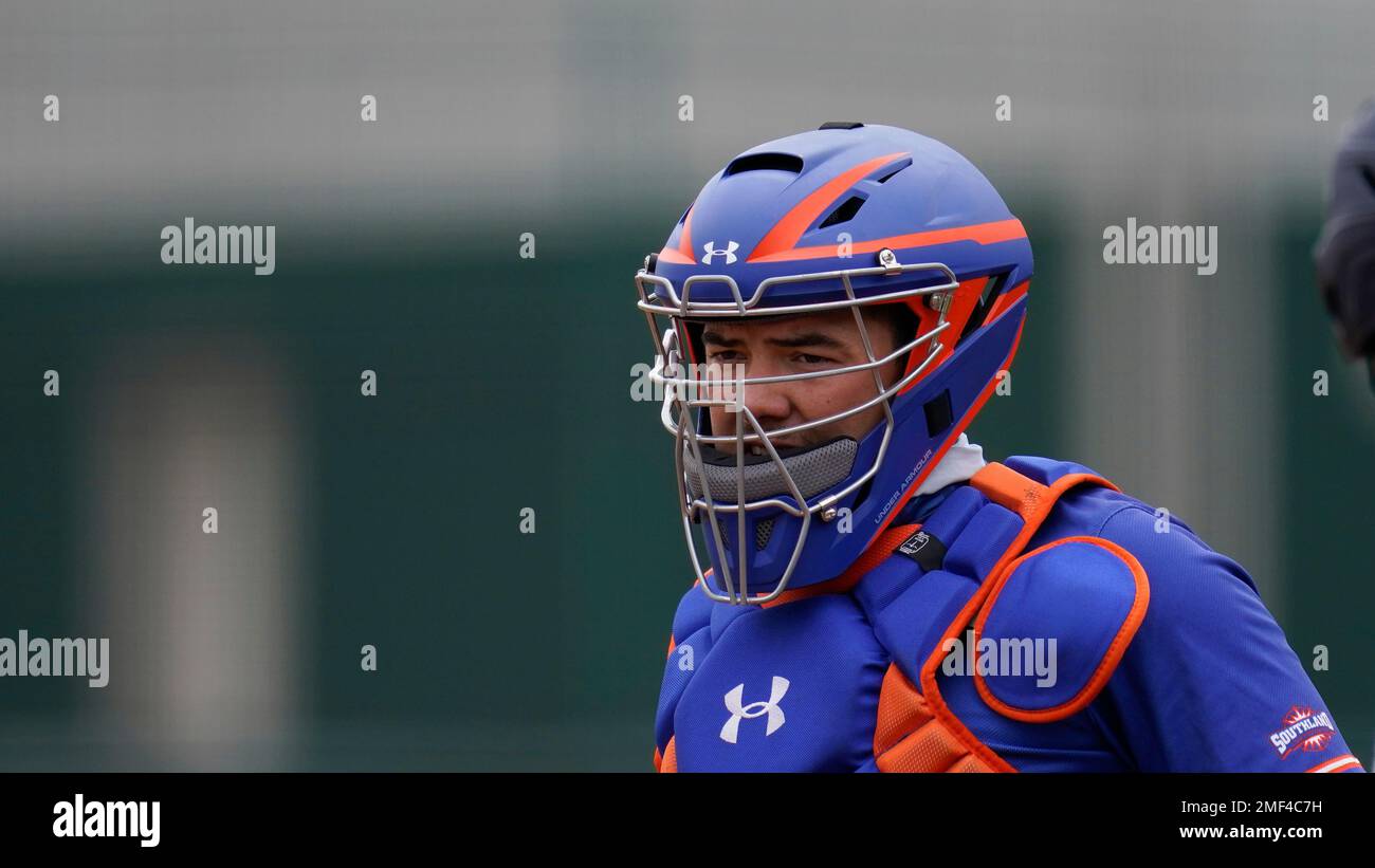 Houston Baptist catcher Matt Solomon (5) looks into the dugout during ...