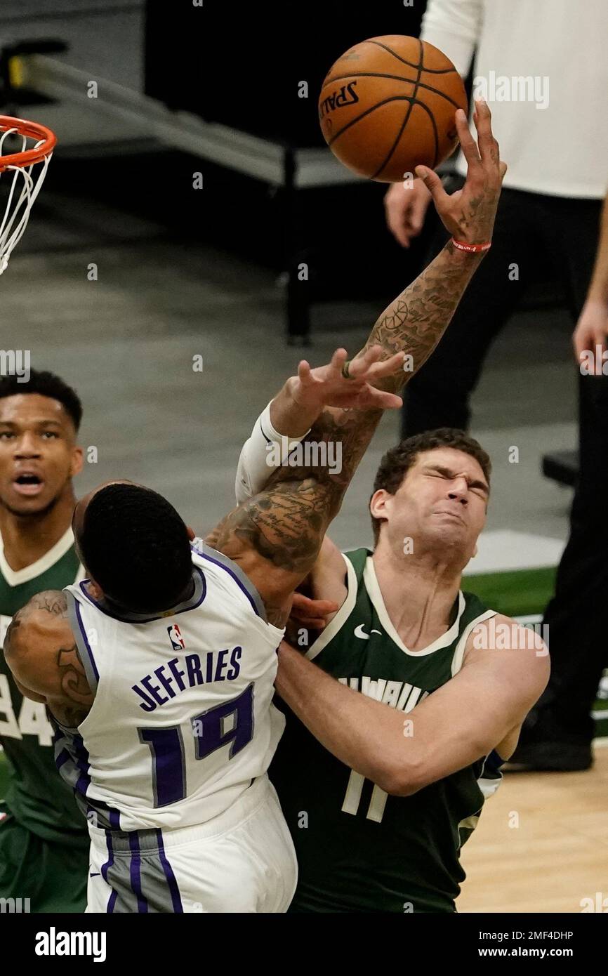 Milwaukee Bucks' Brook Lopez fouls Sacramento Kings' DaQuan Jeffries ...