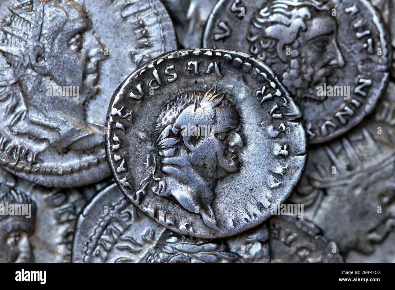 Roman silver denarius coin showing portrait of emperor Flavius ...