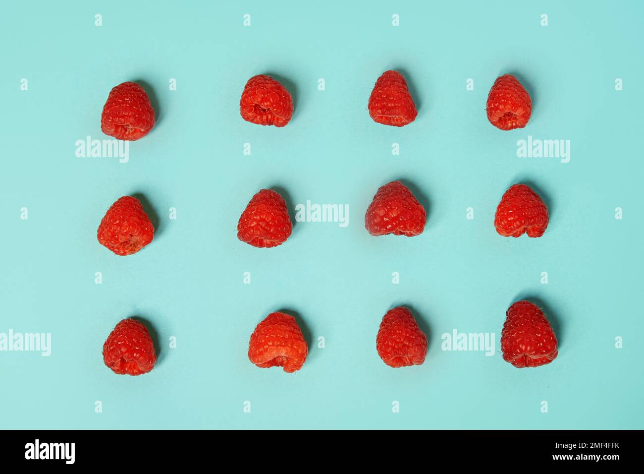 Raspberry pattern on the blue color of the lagoon. Fruits and healthy ...