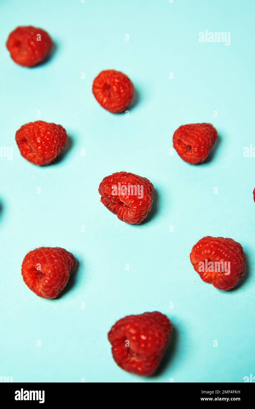 Raspberry pattern on the blue color of the lagoon. Fruits and healthy ...