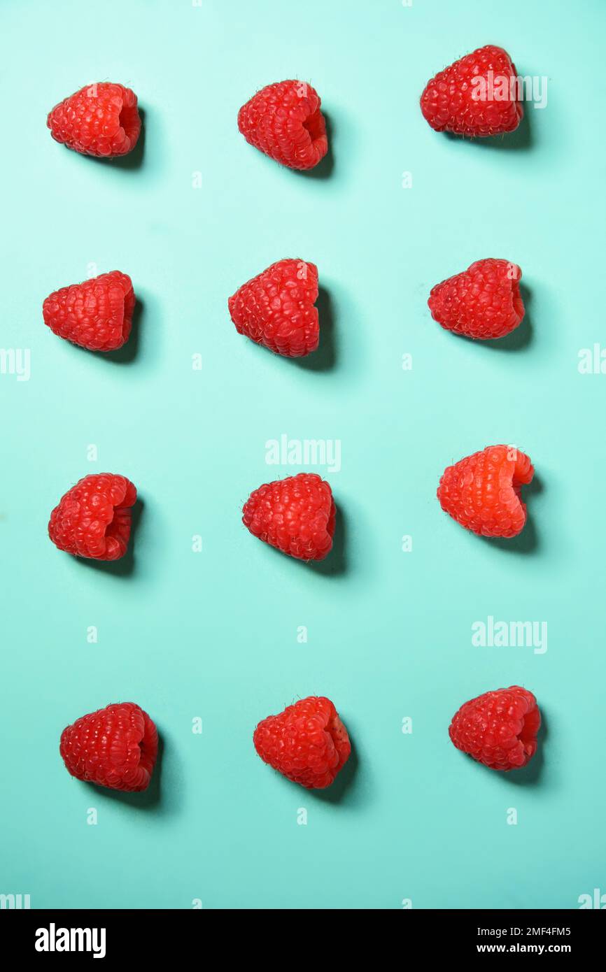 Raspberry pattern on the blue color of the lagoon. Fruits and healthy ...
