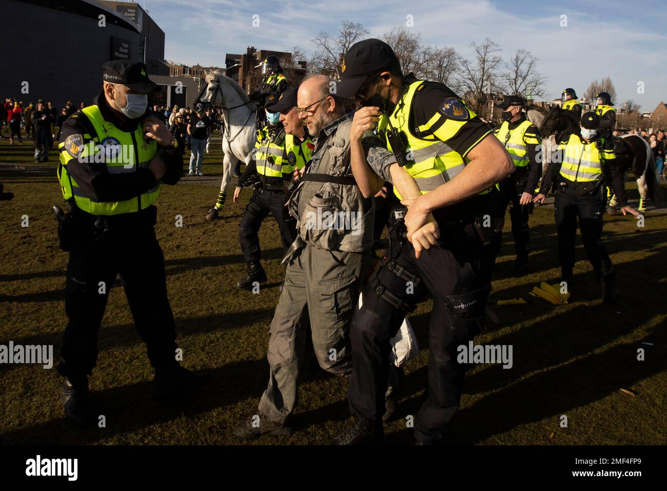 Dutch police detain a man during a demonstration of several hundreds of ...