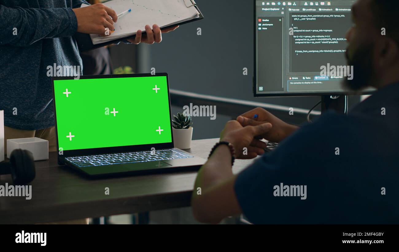 Database Admins Analyzing Source Code And Greenscreen Display On Computer To Develop Software
