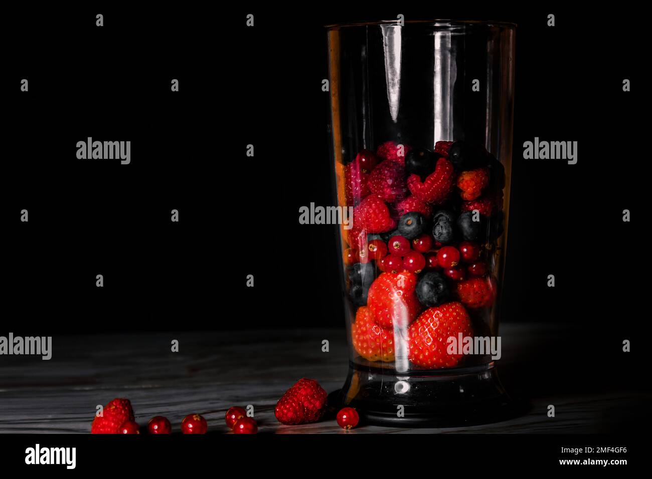 Fruit in a blender, mixer. Fruit cocktail and healthy food and drinks ...