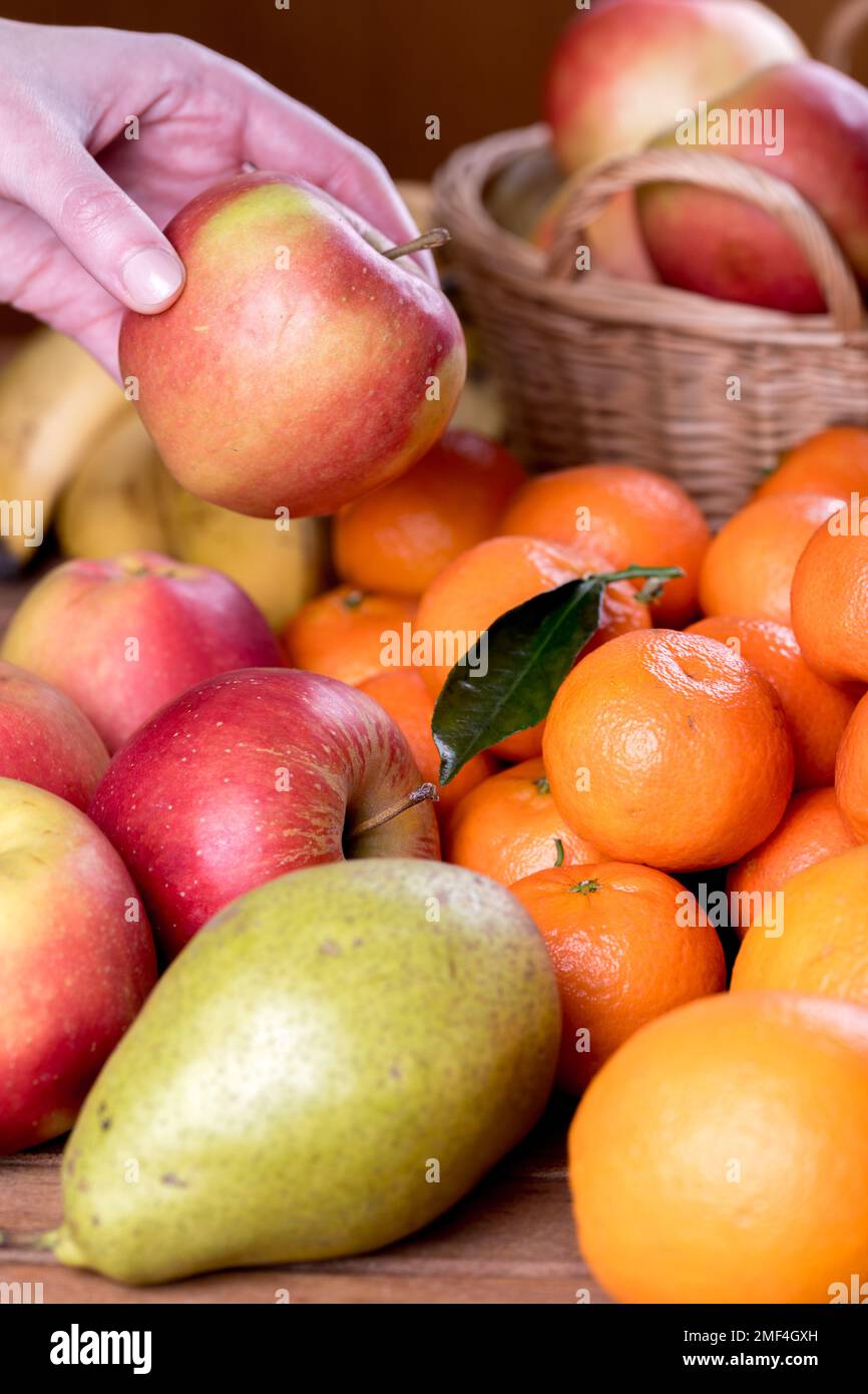 Mix of fresh fruits. Apples, oranges, mandarins, bananas and pear on ...