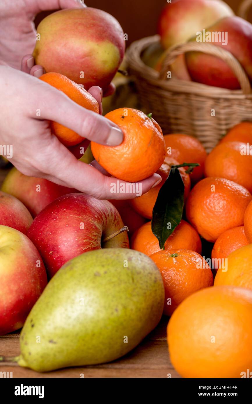 Mix of fresh fruits. Apples, oranges, mandarins, bananas and pear on ...