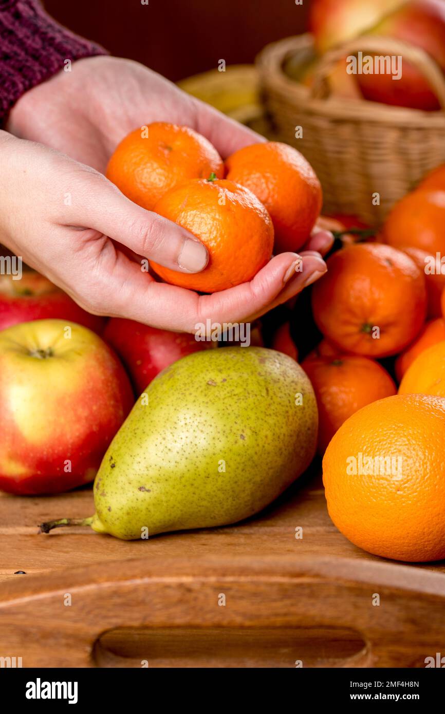 Mix of fresh fruits. Apples, oranges, mandarins, bananas and pear on ...