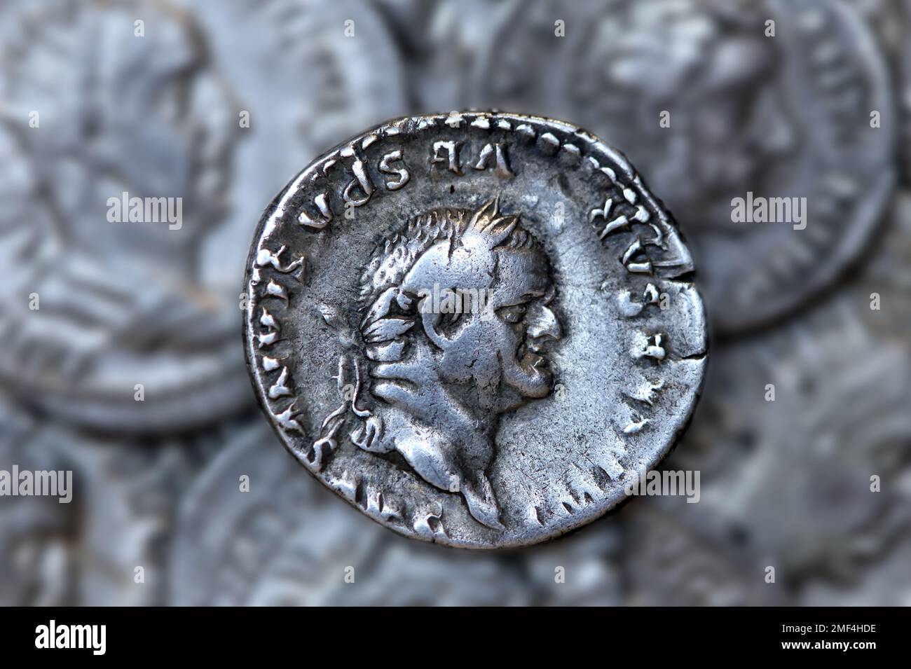 Roman silver denarius coin showing portrait of emperor Flavius ...
