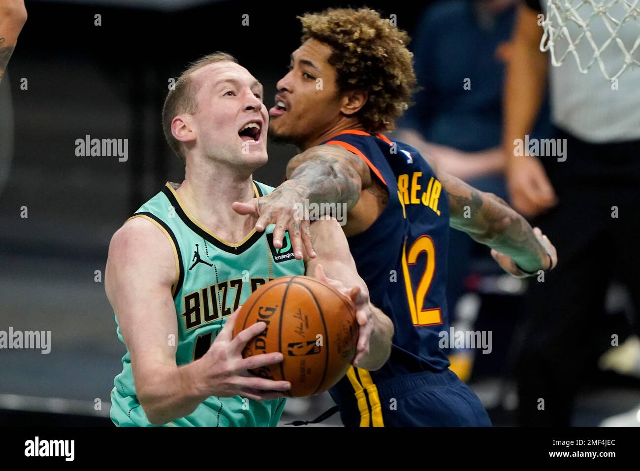 Charlotte Hornets guard Devonte' Graham, left, is fouled by Golden ...