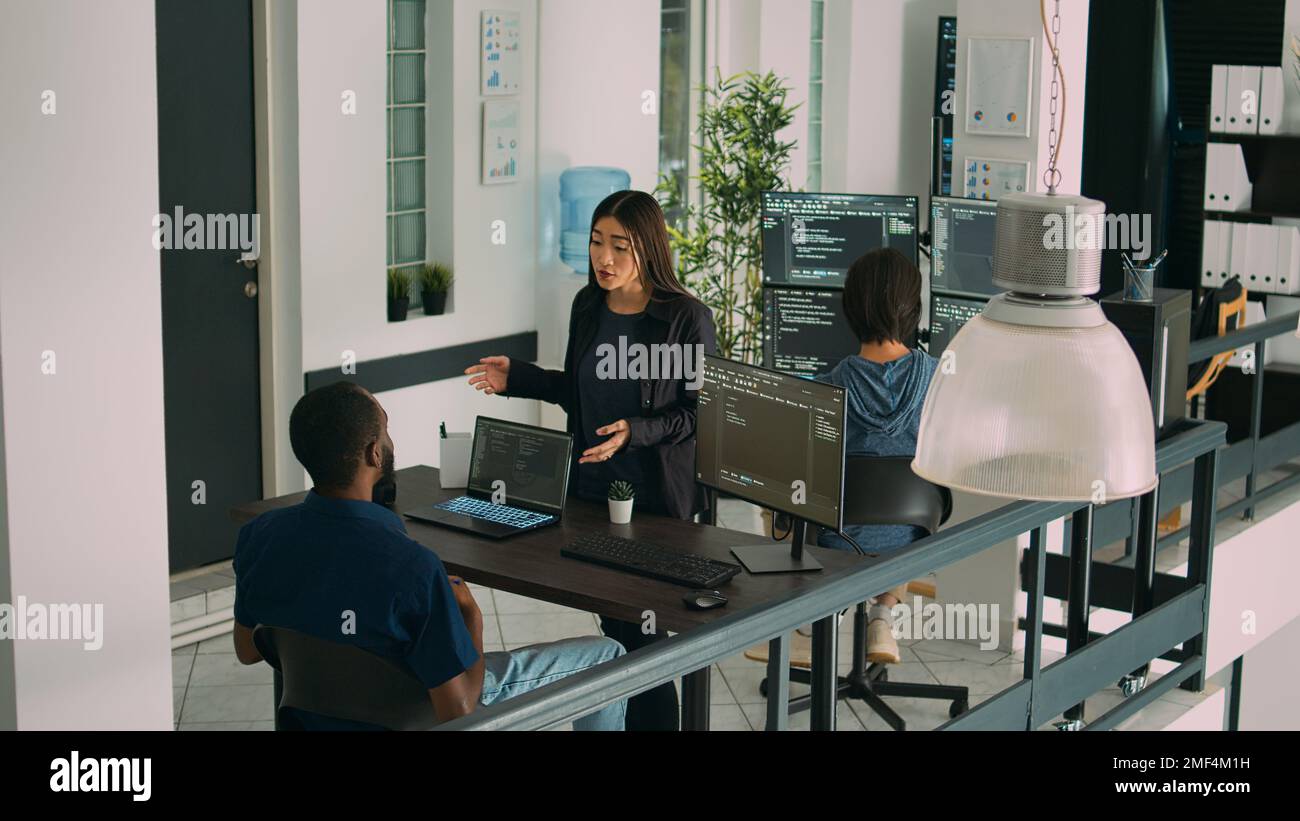 Diverse Coders Talking About Source Code On Terminal Window Using Html Script To Create New