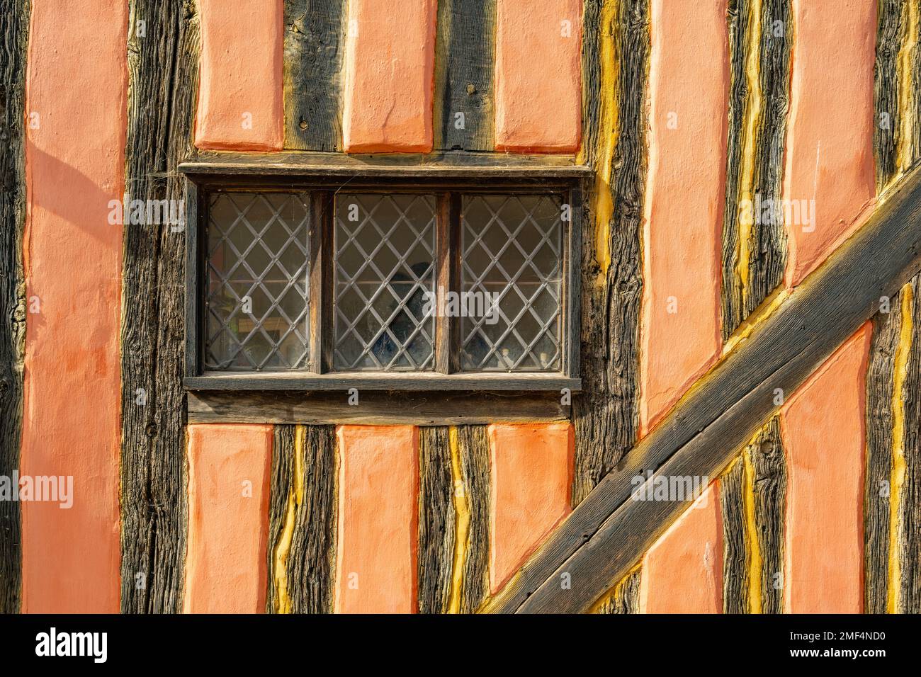 Timber framed building painted with natural ochre paint in Lavenham ...