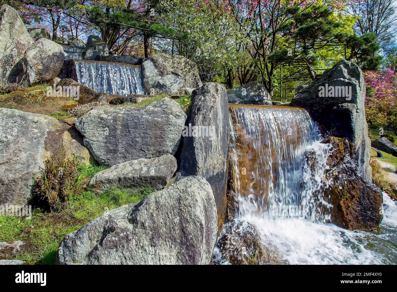 Waterfall in Hasselt's Japanese Garden. The spray is flying. Large ...