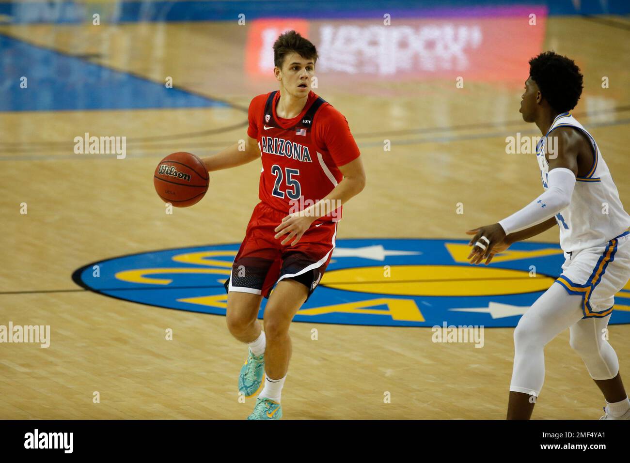 Arizona guard Kerr Kriisa (25) drives during an NCAA college basketball ...