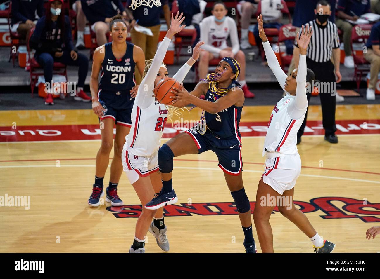 St. John's forwards Rayven Peeples (20) and Raven Farley (4) defend ...